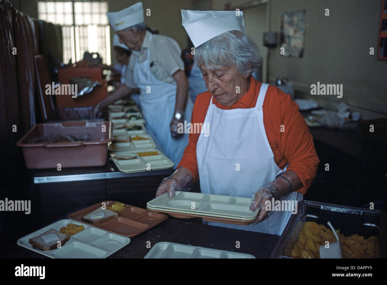 old people employed as dinner ladies working in a school Stock Photo ...