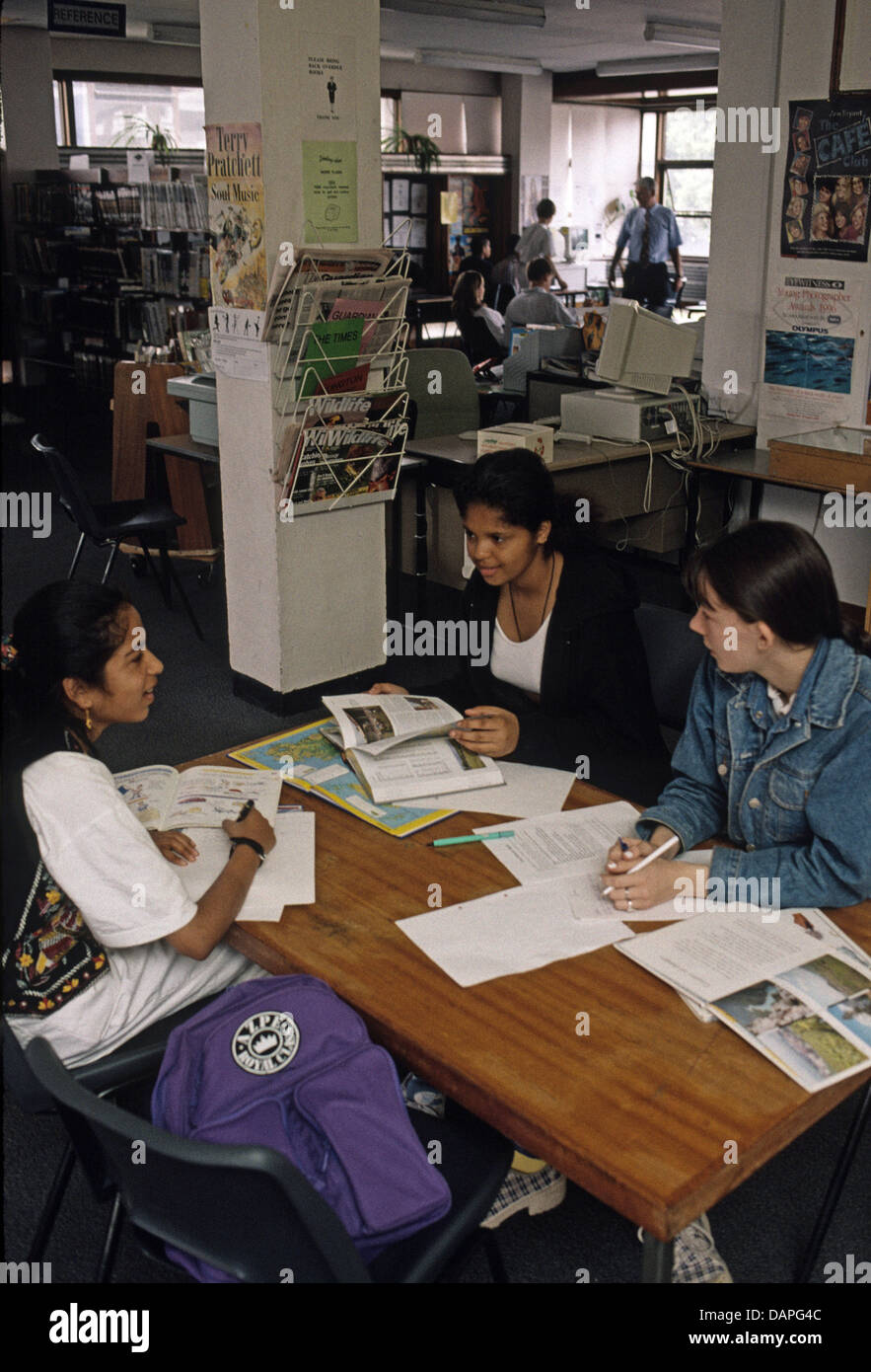 Group of girls studying in library Stock Photo - Alamy