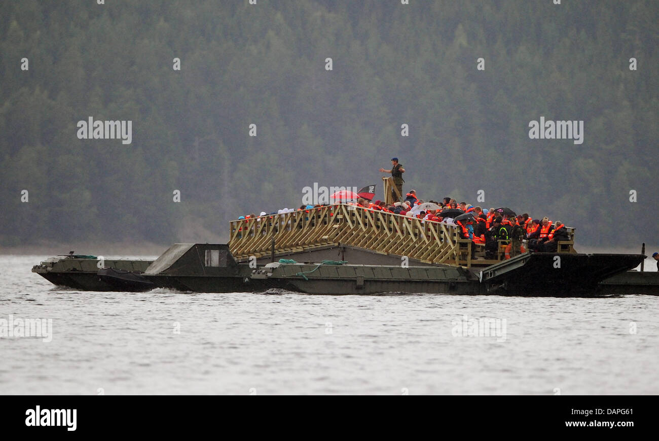 Relatives of the victims that died in the shooting stand on a ferry to ...