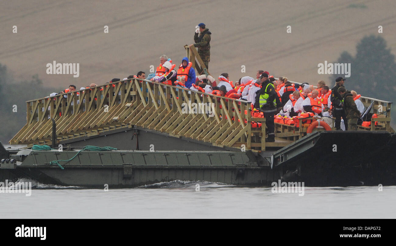 Relatives of the victims that died in the shooting stand on a ferry to ...