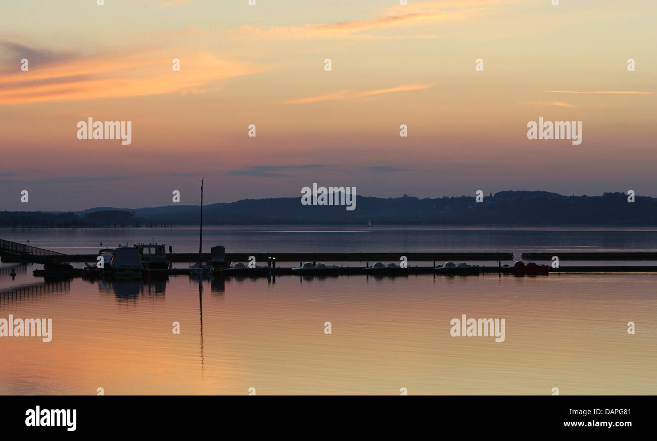 The sun sets at Lake Brombach near Pleinfeld, Germany, 18 August 2011 ...