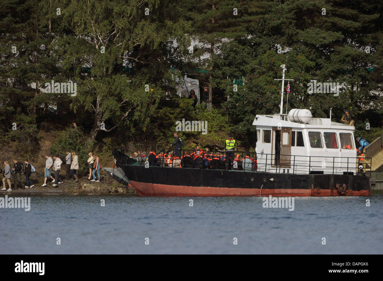 Survivors of the Utoya massacre and their relatives arrive on a boat on ...