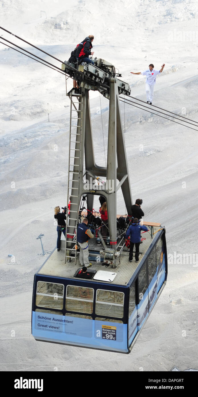 Swiss tightrope walker Freddy Nock walks on the carrying cable of the ...