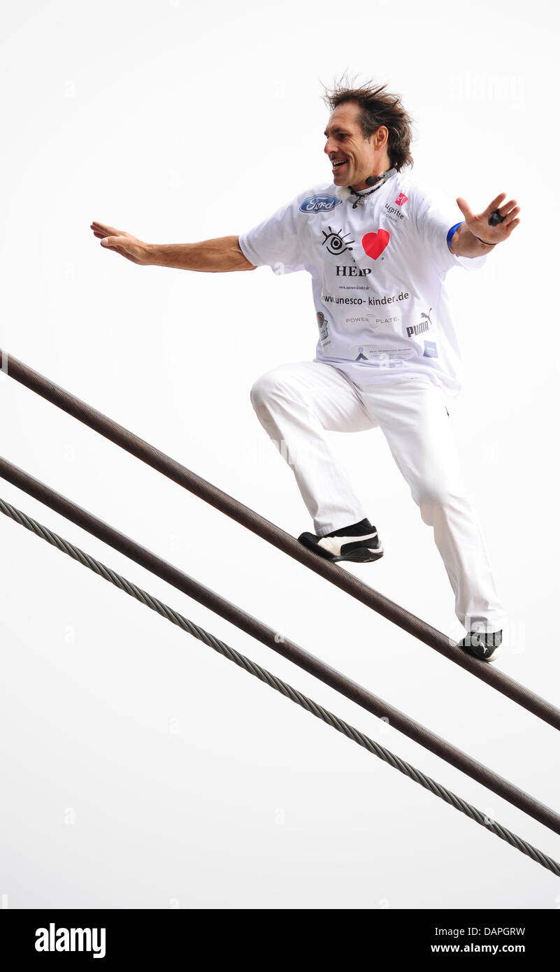 Swiss tightrope walker Freddy Nock walks on the carrying cable of the ...