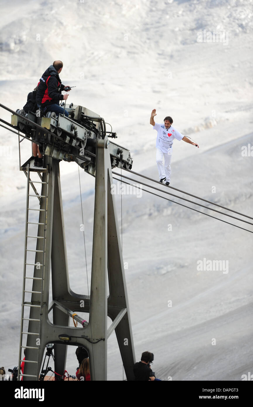 Swiss tightrope walker Freddy Nock walks on the carrying cable of the ...