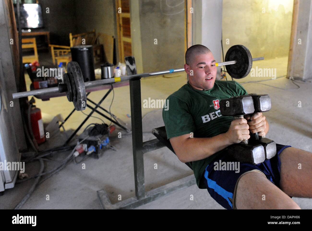 A Bundeswehr soldier lifts weights in the military camp in the district ...