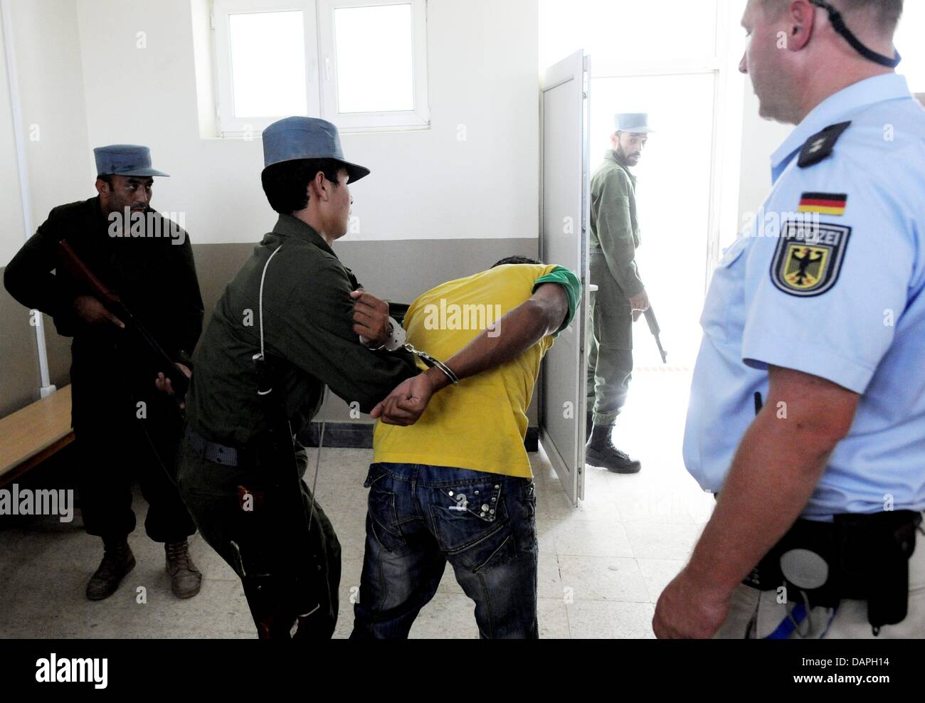 Afghan policemen attend a police training by German police officers in ...