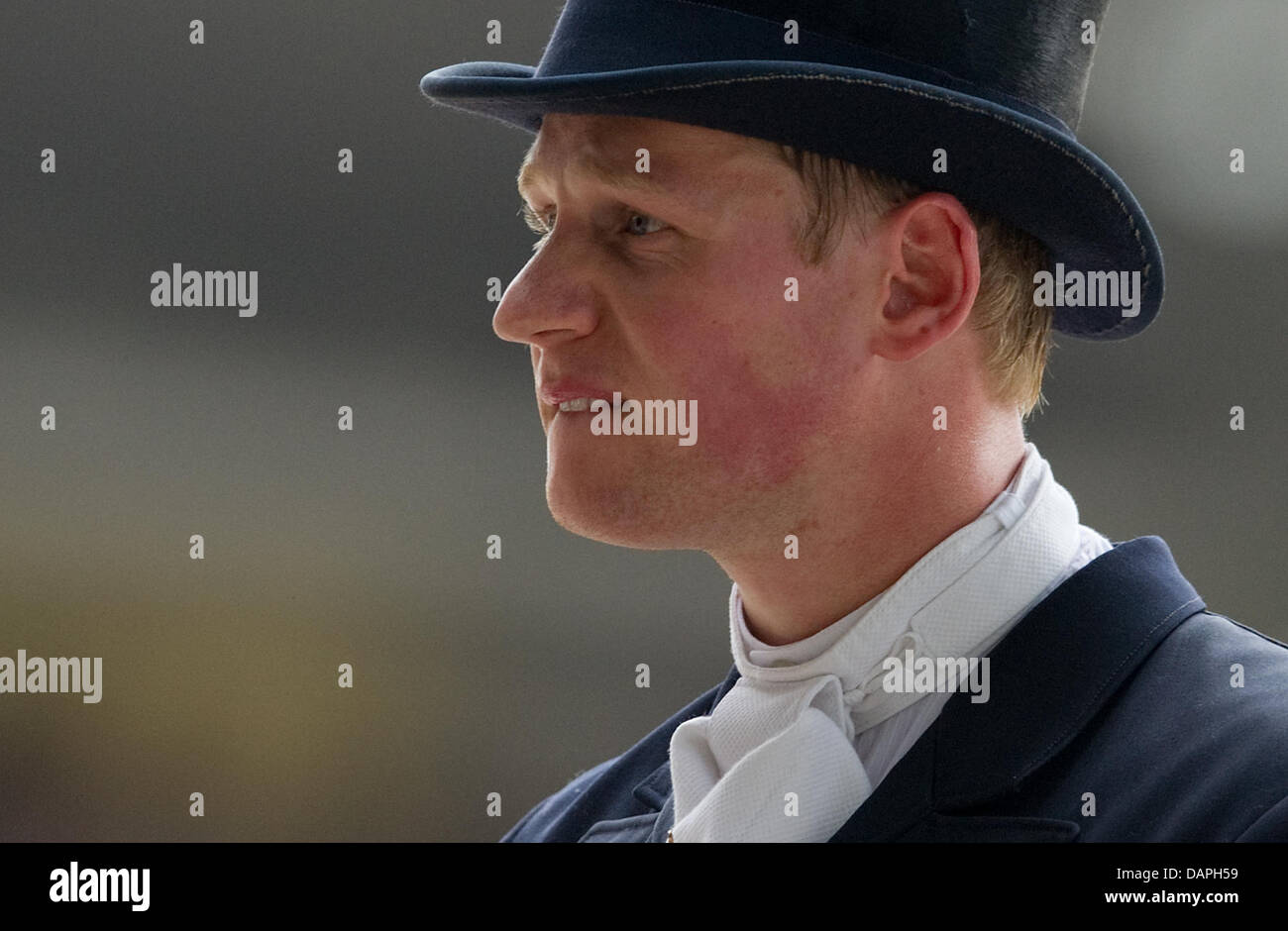 Germany's Matthias Alexander Rath pulls a face after his turn in the ...