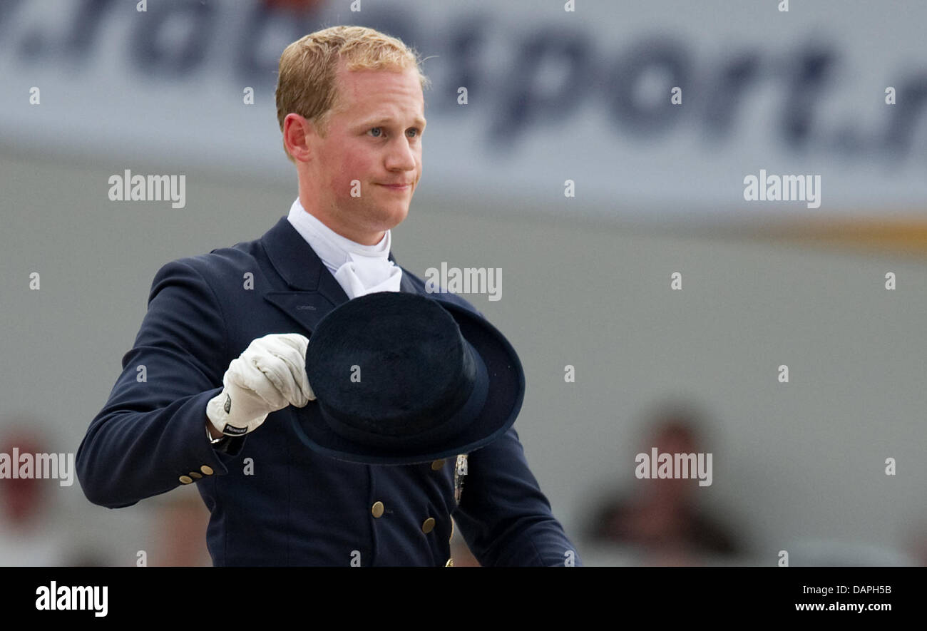 Germany's Matthias Alexander Rath holds his hat in his hand after his ...