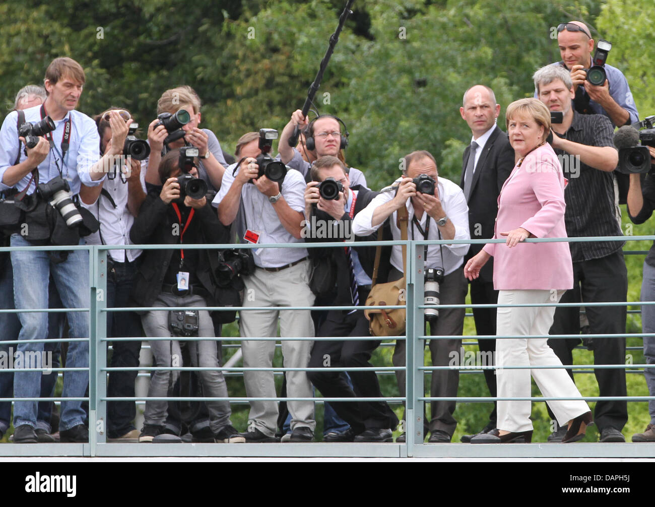German Chancellor Angela Merkel poses for the press on the bridge of ...