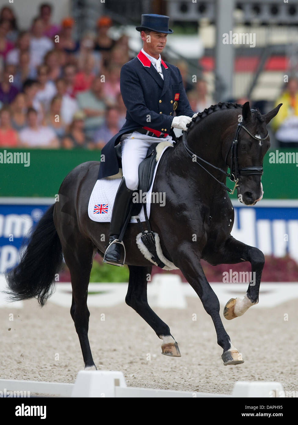 British dressage rider Carl Hester rides his horse Uthopia during the ...