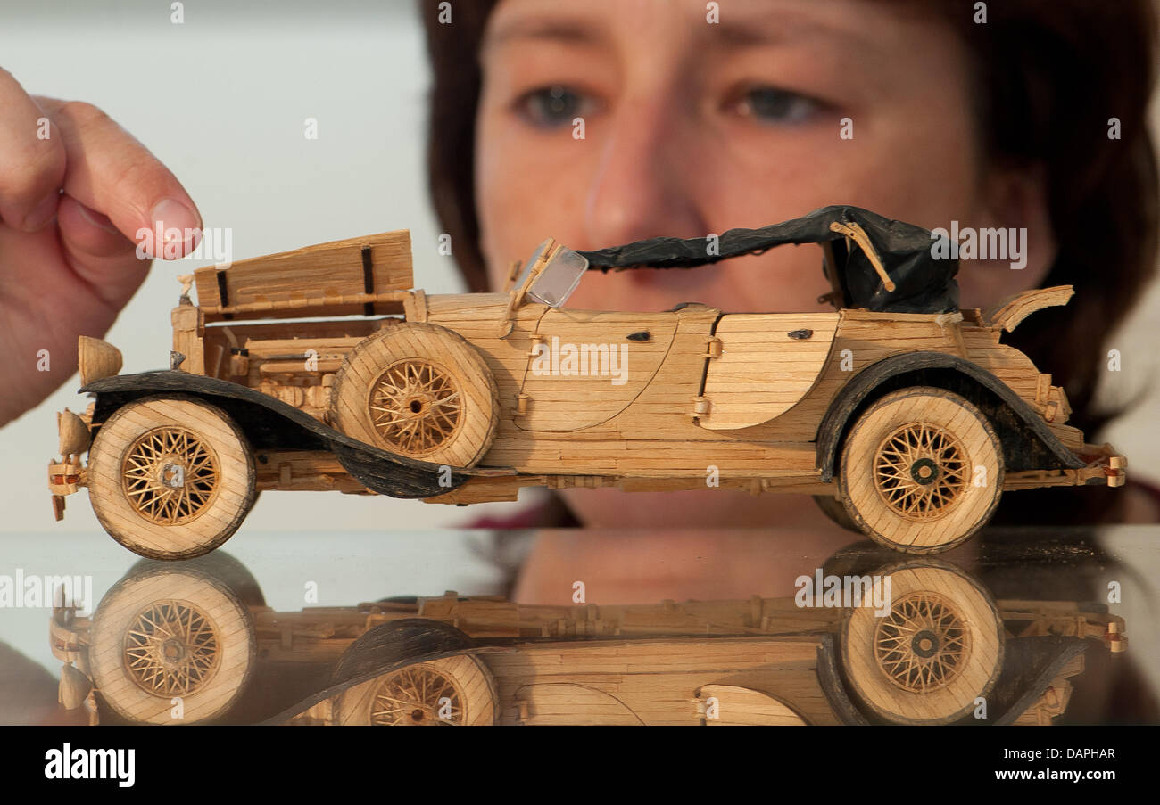 A woman looks at a miniature car made of matches at the Match Museum in ...
