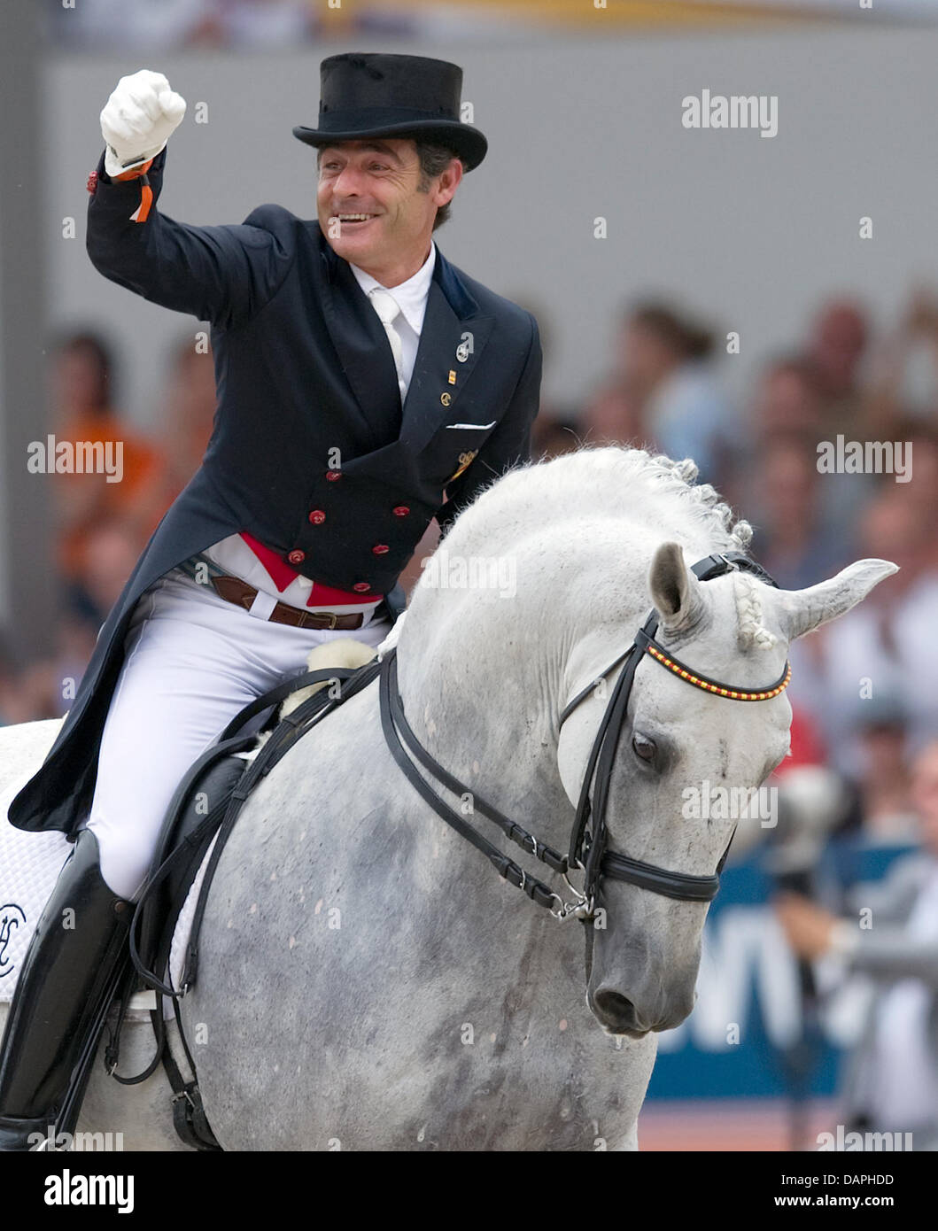 Spanish equestrian Juan Manuel Munoz Diaz cheers on his horse Fuego de ...
