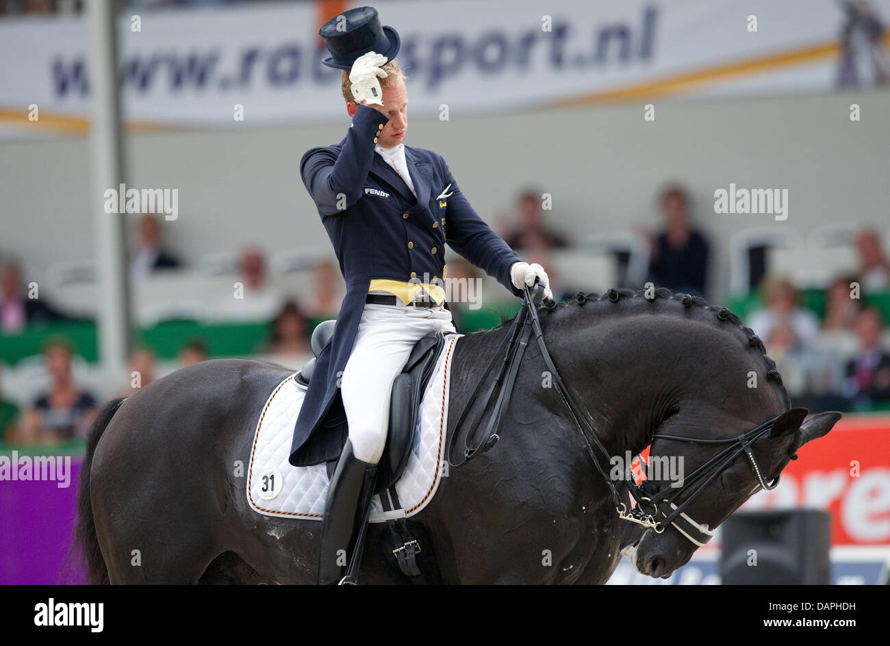 German equestrian Matthias Alexander Rath grimaces after the Grand Prix ...