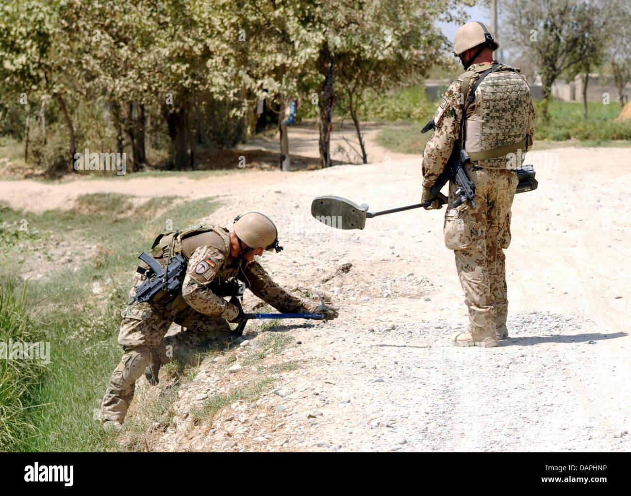 German Federal Armed Soldiers of the bomb disposal unit seach for ...
