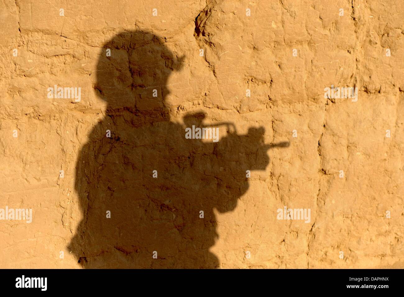 The shadow of a German Federal Armed soldier is seen on a wall in the ...