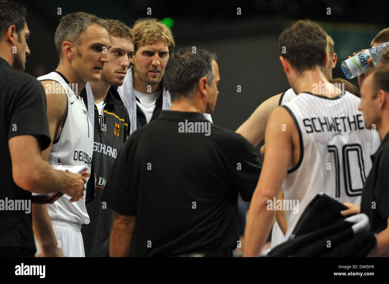 The German basketball team assembles for a time-out during the ...