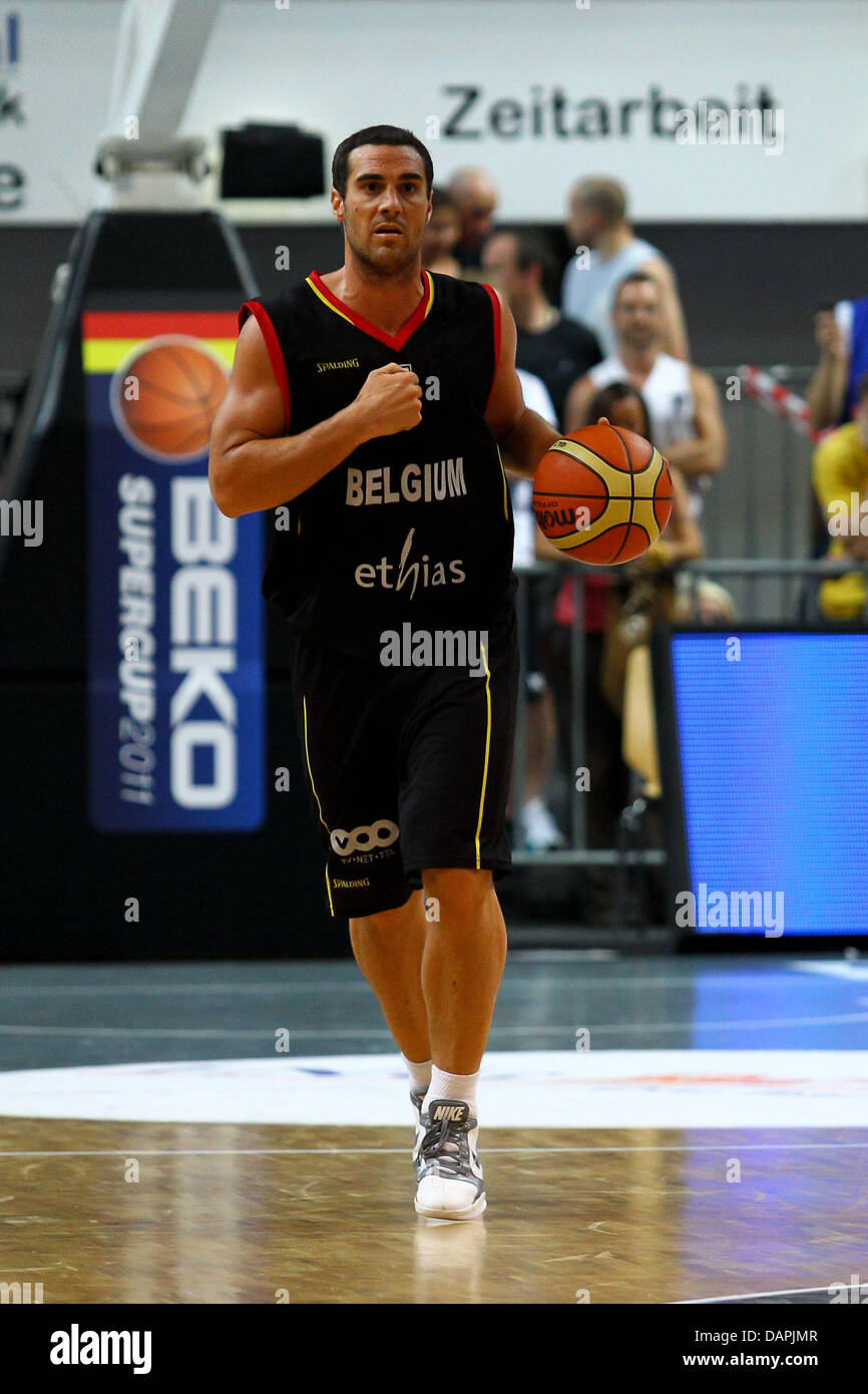 Belgium's national basketball player Sam van Rossom dribbles the ball ...