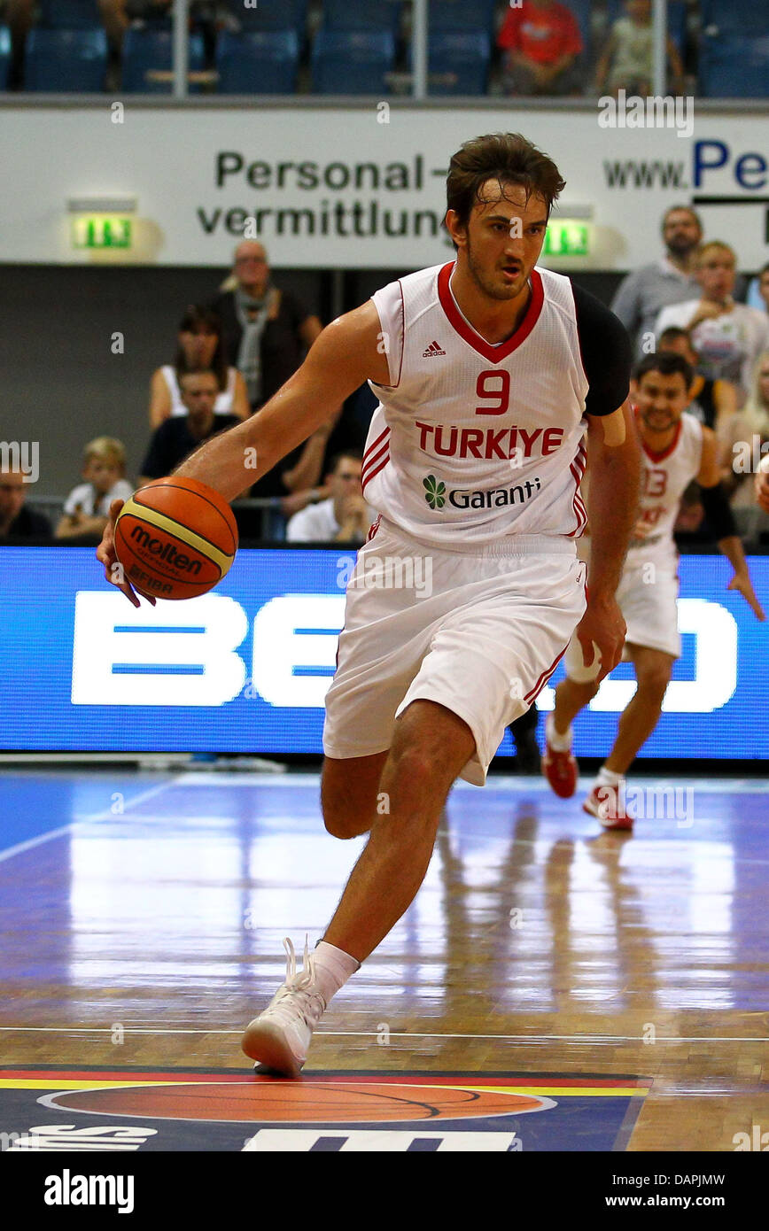 Turkish national basketball player Semih Erden dribbles the ball during ...