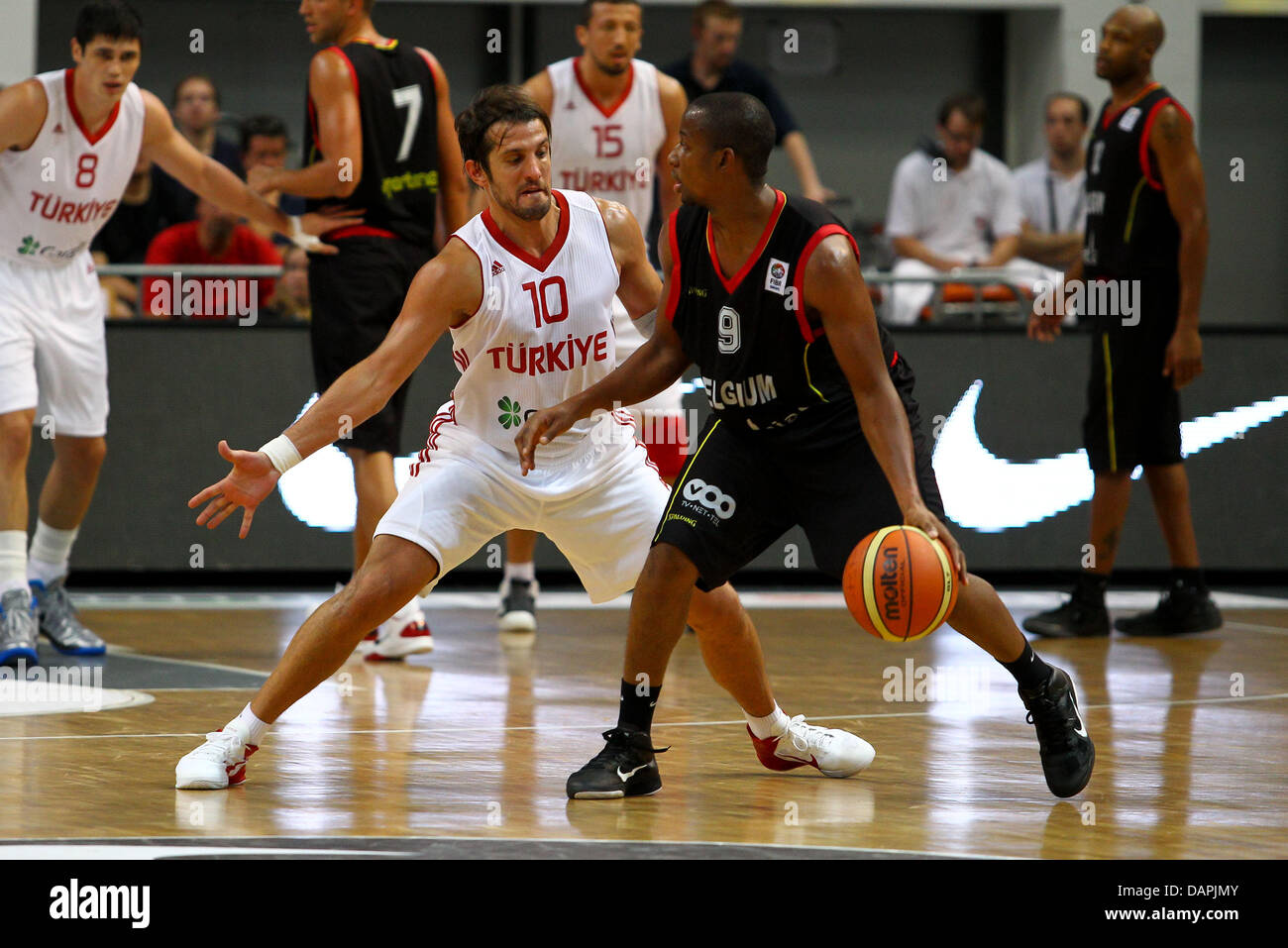 Belgium's national basketball player Jonathan Tabu-Eboma (R) dribbles ...