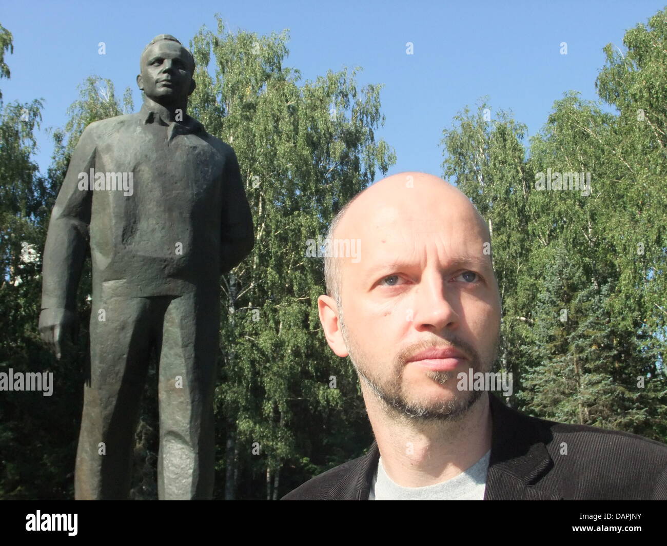 German film director Veit Helmer stands in front of a monument of ...