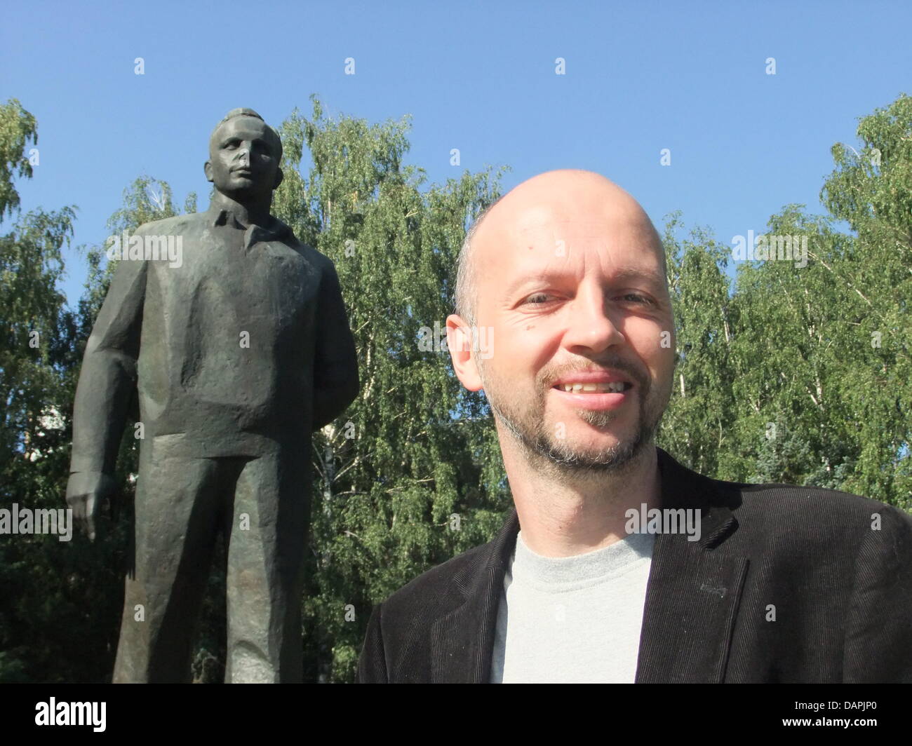 German film director Veit Helmer stands in front of a monument of ...
