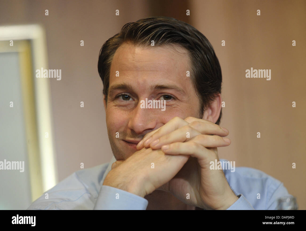 German actor David Rott smiles during a press conference in Hamburg ...
