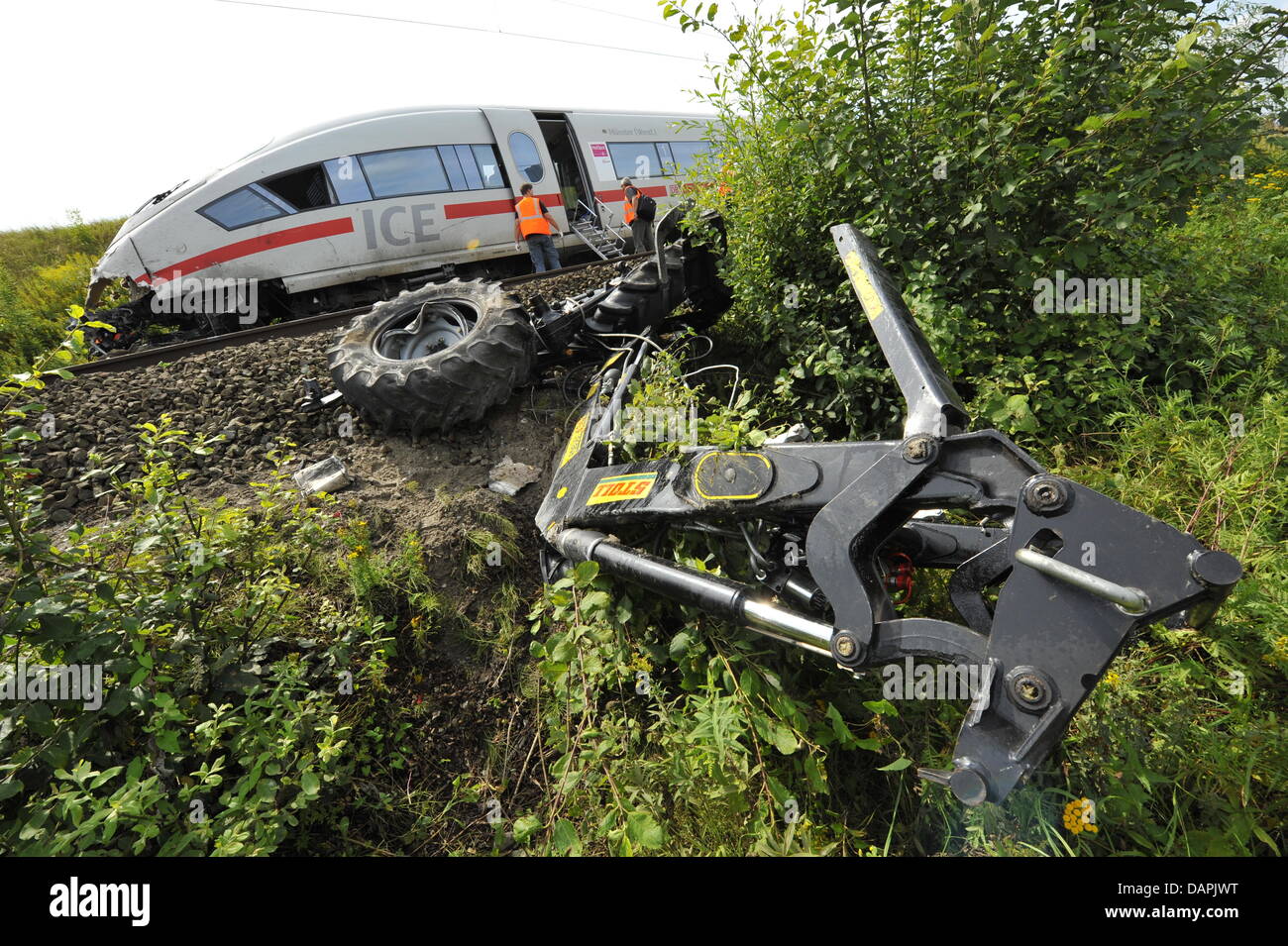 Parts of the wreckage of a tractor is seen after a collision of an ICE ...