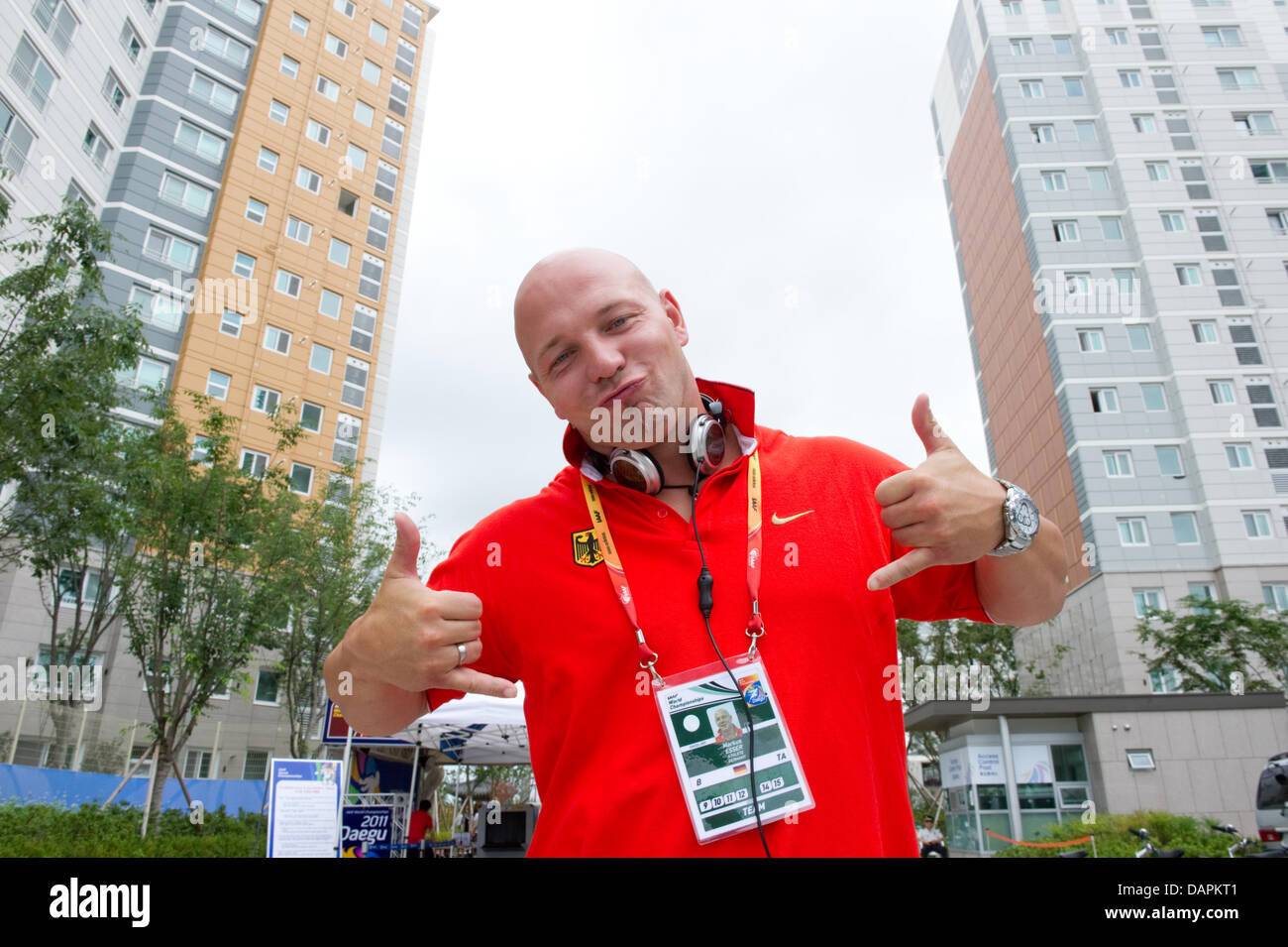 German hammer thrower Jan Esser poses in front of the athlete's village ...