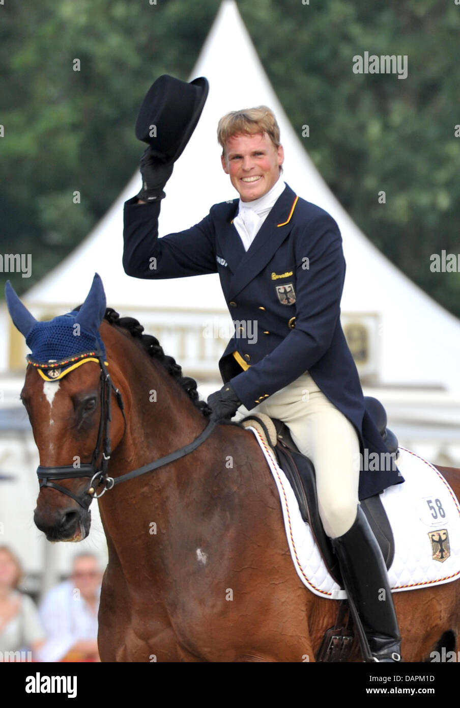 The German eventing equestrian Frank Ostholt cheers on his horse Little ...