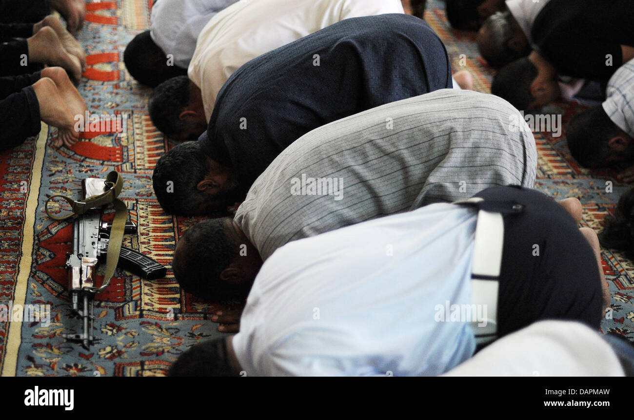 Believers pray on Friday, 26 August 2011 in the Al-Kabir mosque in ...