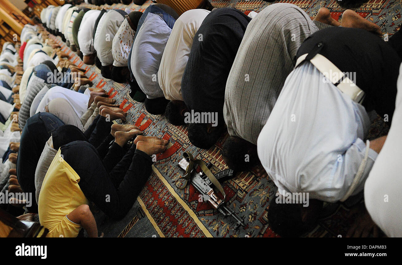 Believers pray on Friday, 26 August 2011 in the Al-Kabir mosque in ...