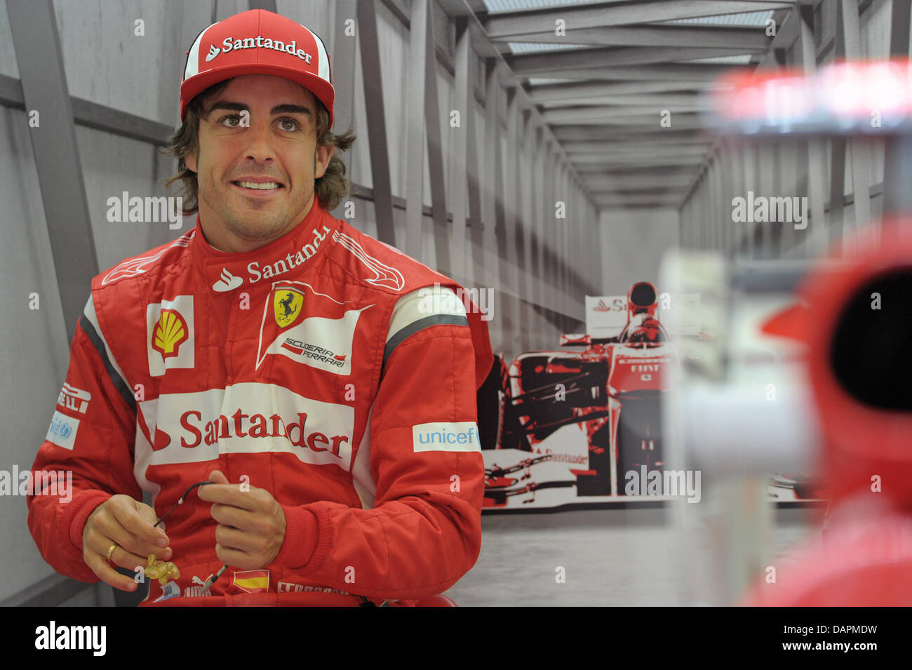 Spanish Formula One driver Fernando Alonso of Ferrari sits in the ...