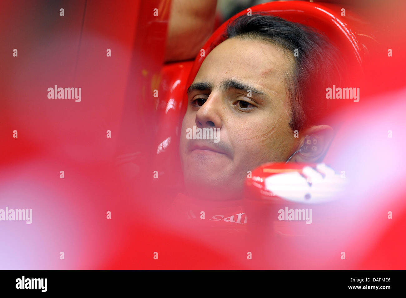 Brazilian Formula One driver Felipe Massa of Ferrari sits in his car ...