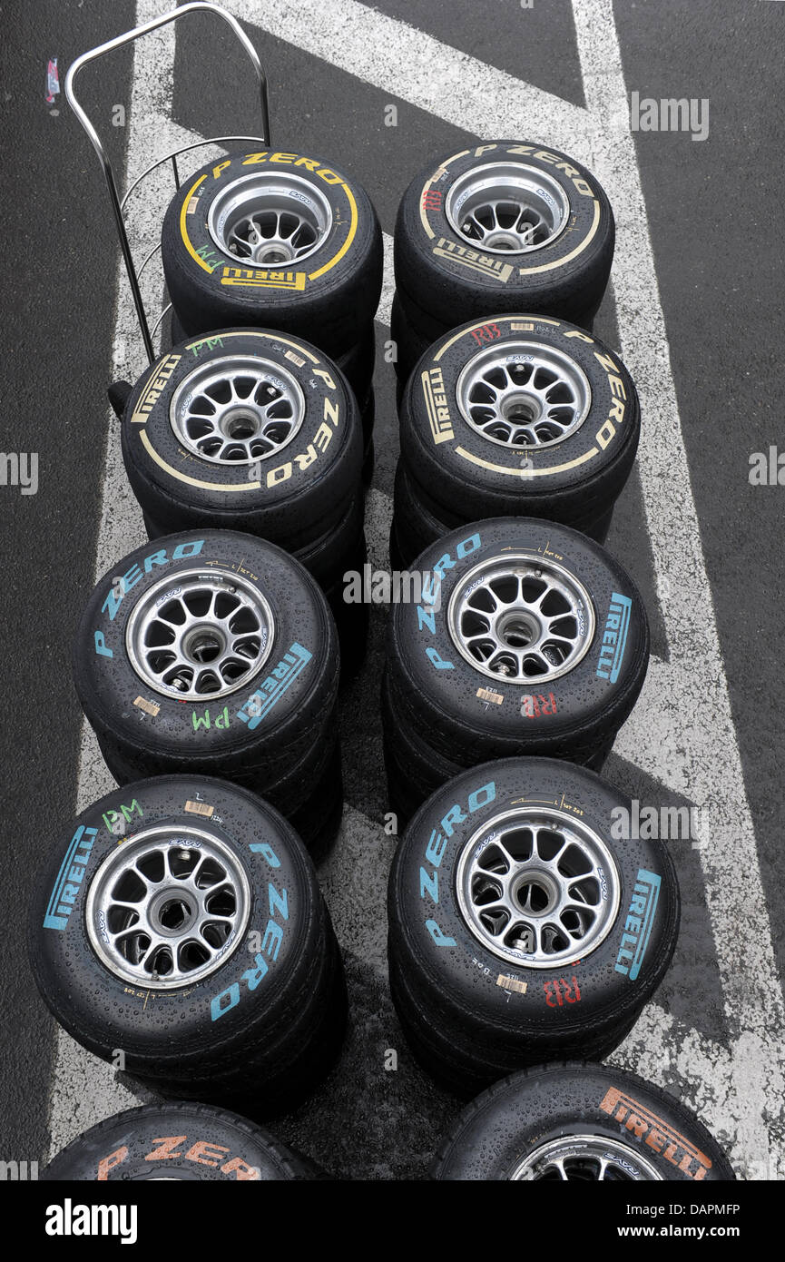 Different kinds of Pirelli tyres are stacked in the paddock at the race ...