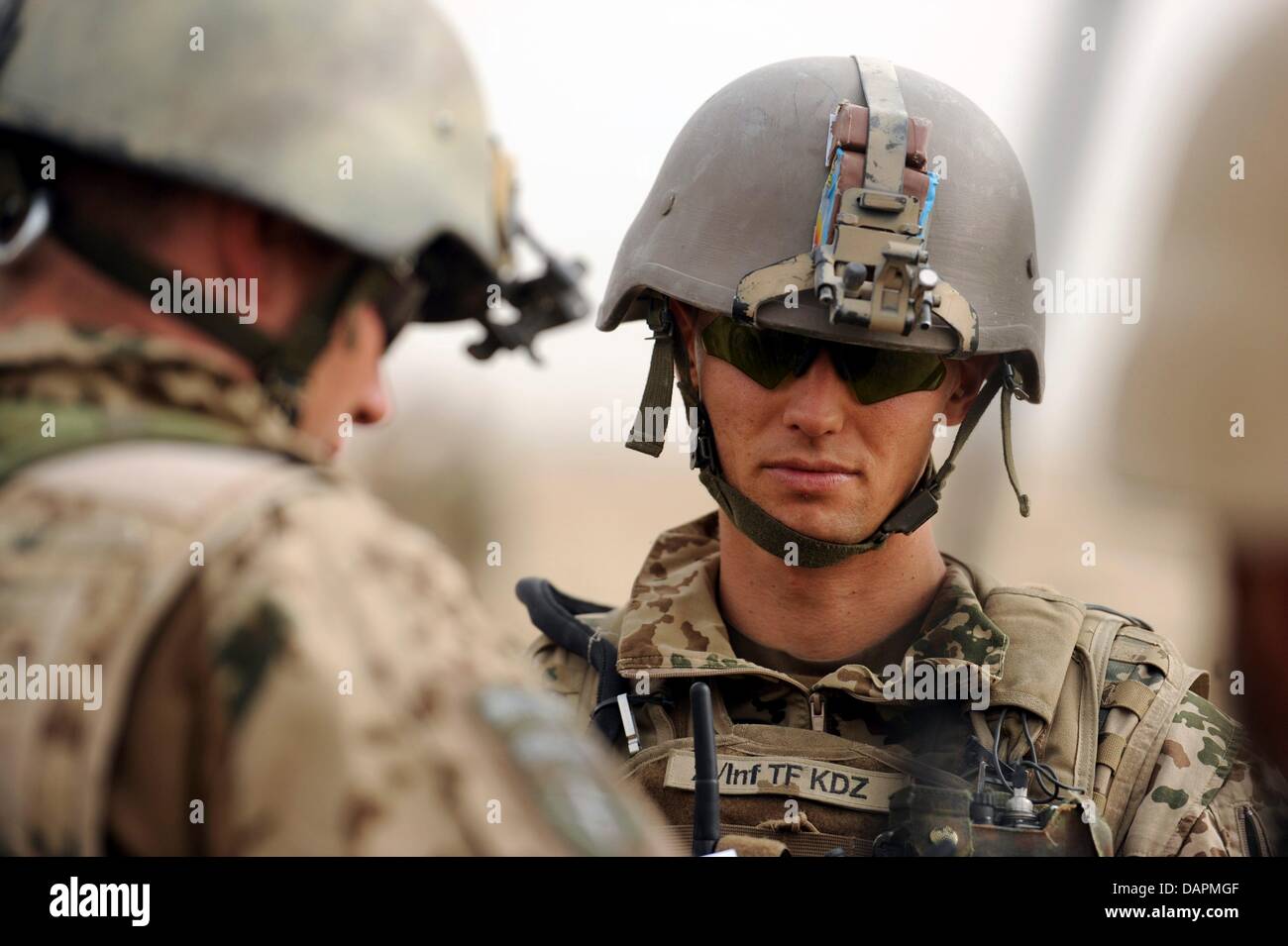 Two Bundeswehr soldiers talk during a minesweeping mission near Kundus ...
