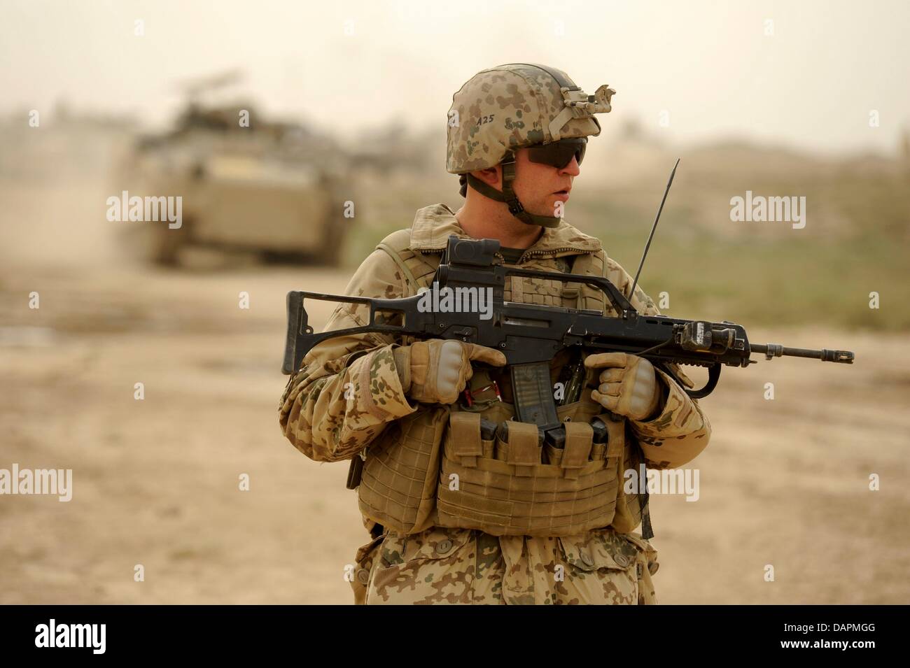 A Bundeswehr soldier roams through the desert during a minesweeping ...