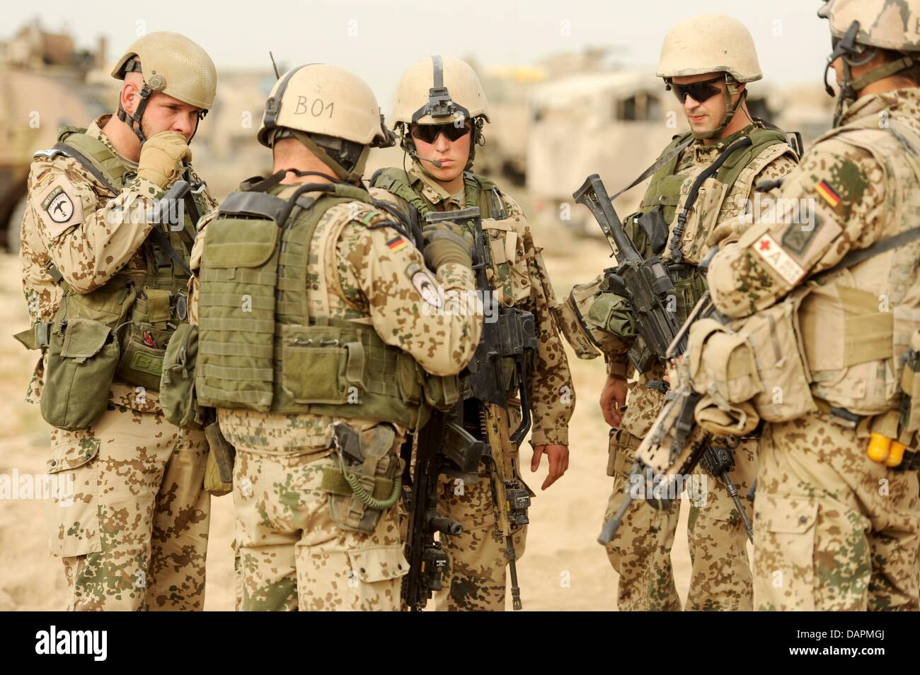A group of Bundeswehr soldiers talk during a minesweeping mission near ...
