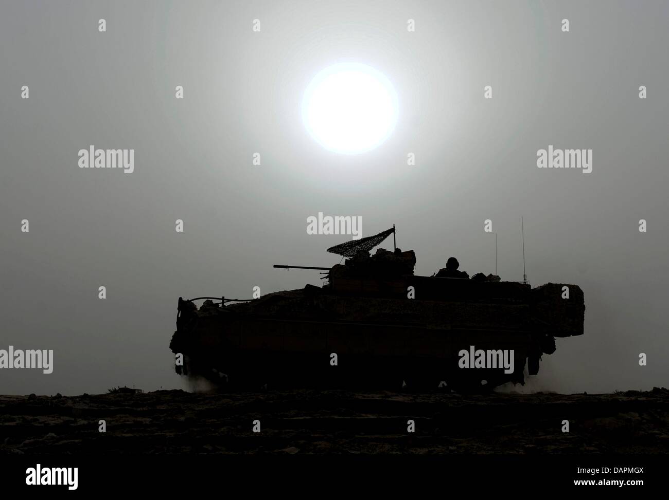A Bundeswehr 'Marder' tank drives through the desert during a ...
