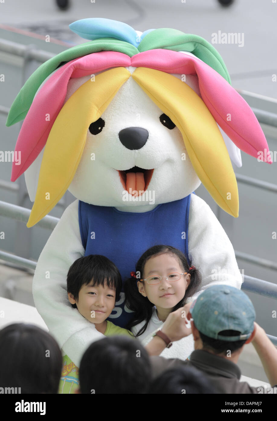 Children are photographed with Sarbi the mascot at the beginning of the ...