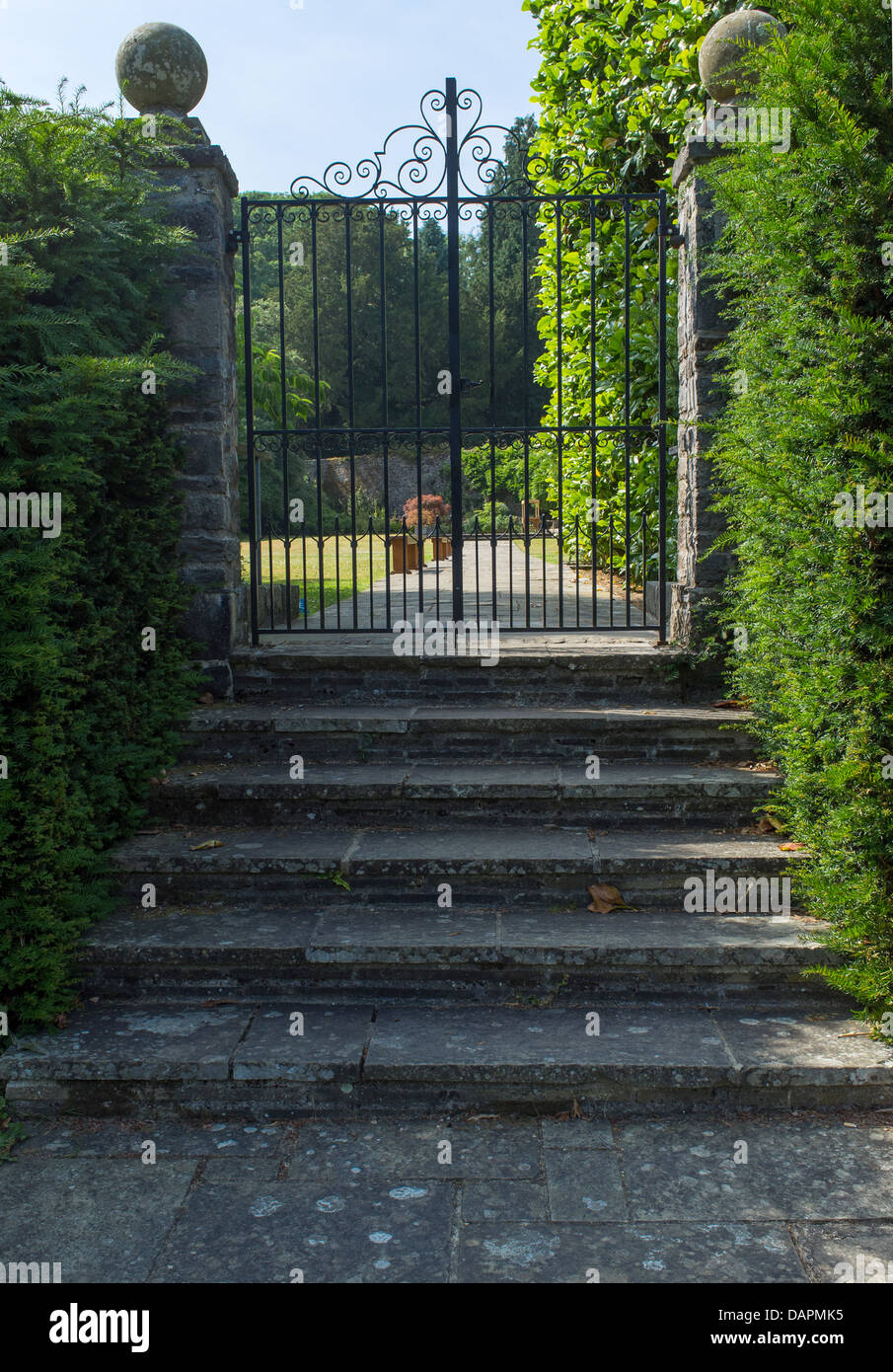 Dartington, Devon, England. July 15th 2013. Flagstone paving lead to ...
