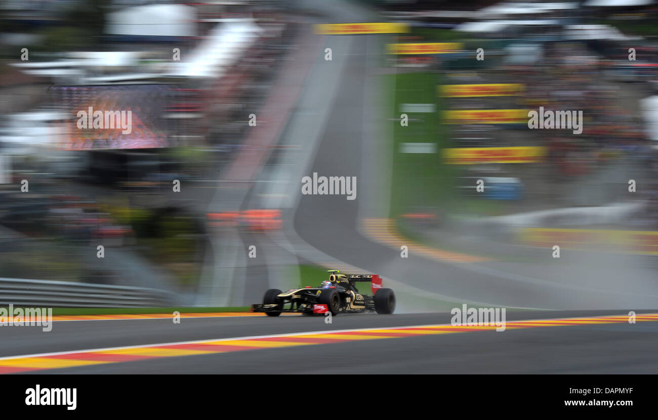 Russian Formula One driver Vitaly Petrov of Lotus Renault steers his ...