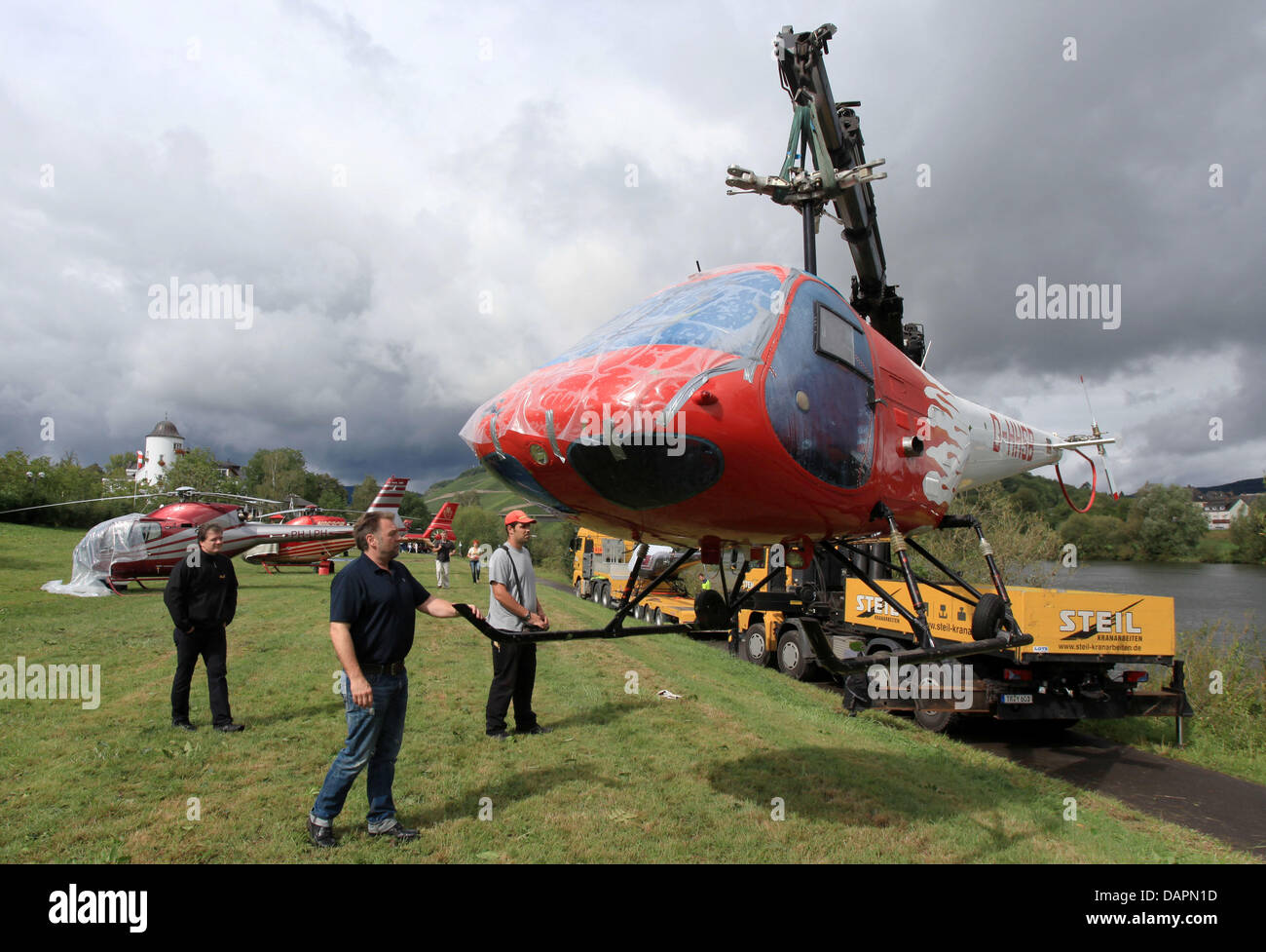 Damaged helicoptera are carted off in Muelheim an der Mosel, Germany ...