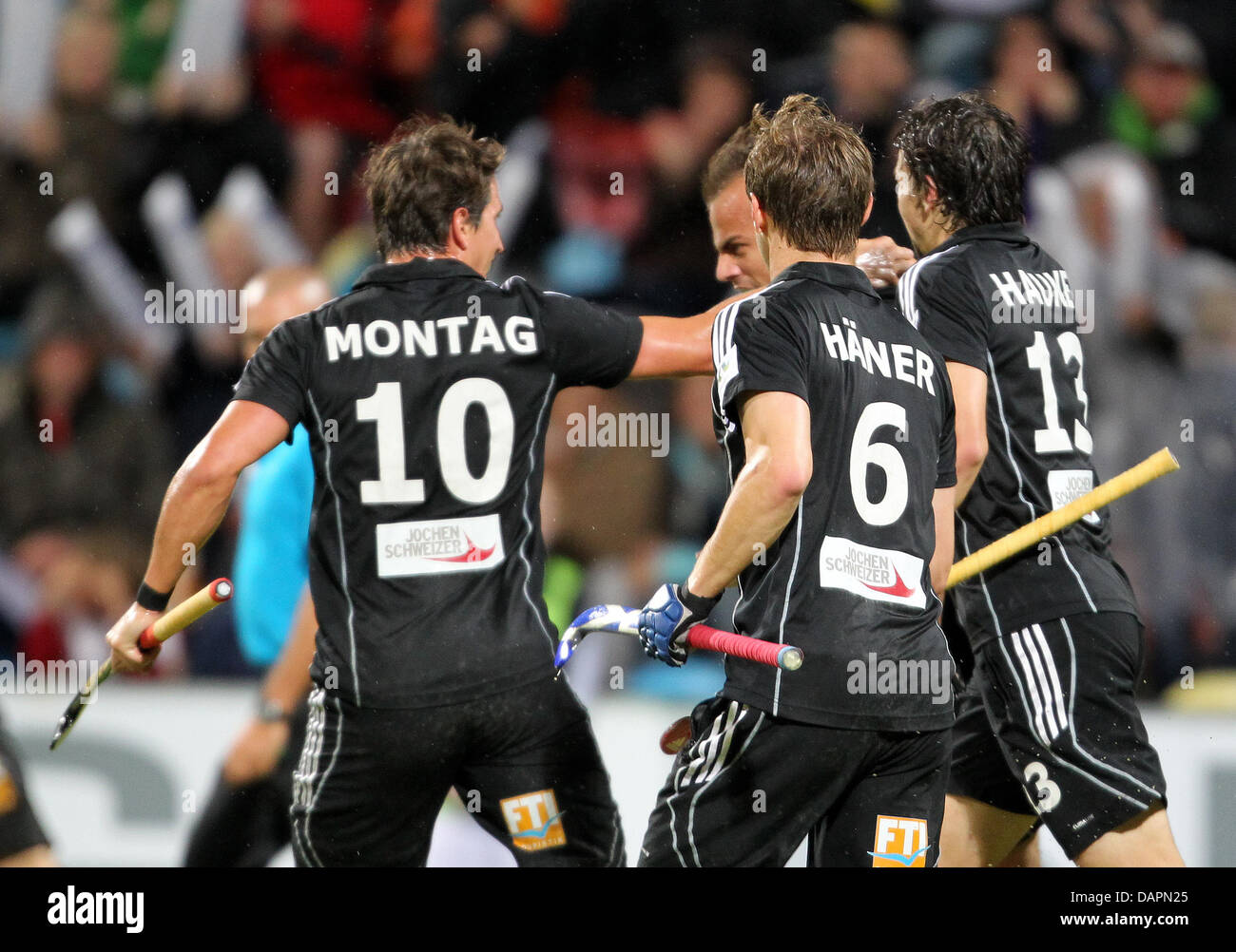 German national hockey player Philipp Zeller (BACK-C) celebrates his ...