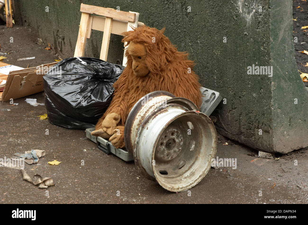 A toy monkey thrown out with rubbish Stock Photo - Alamy