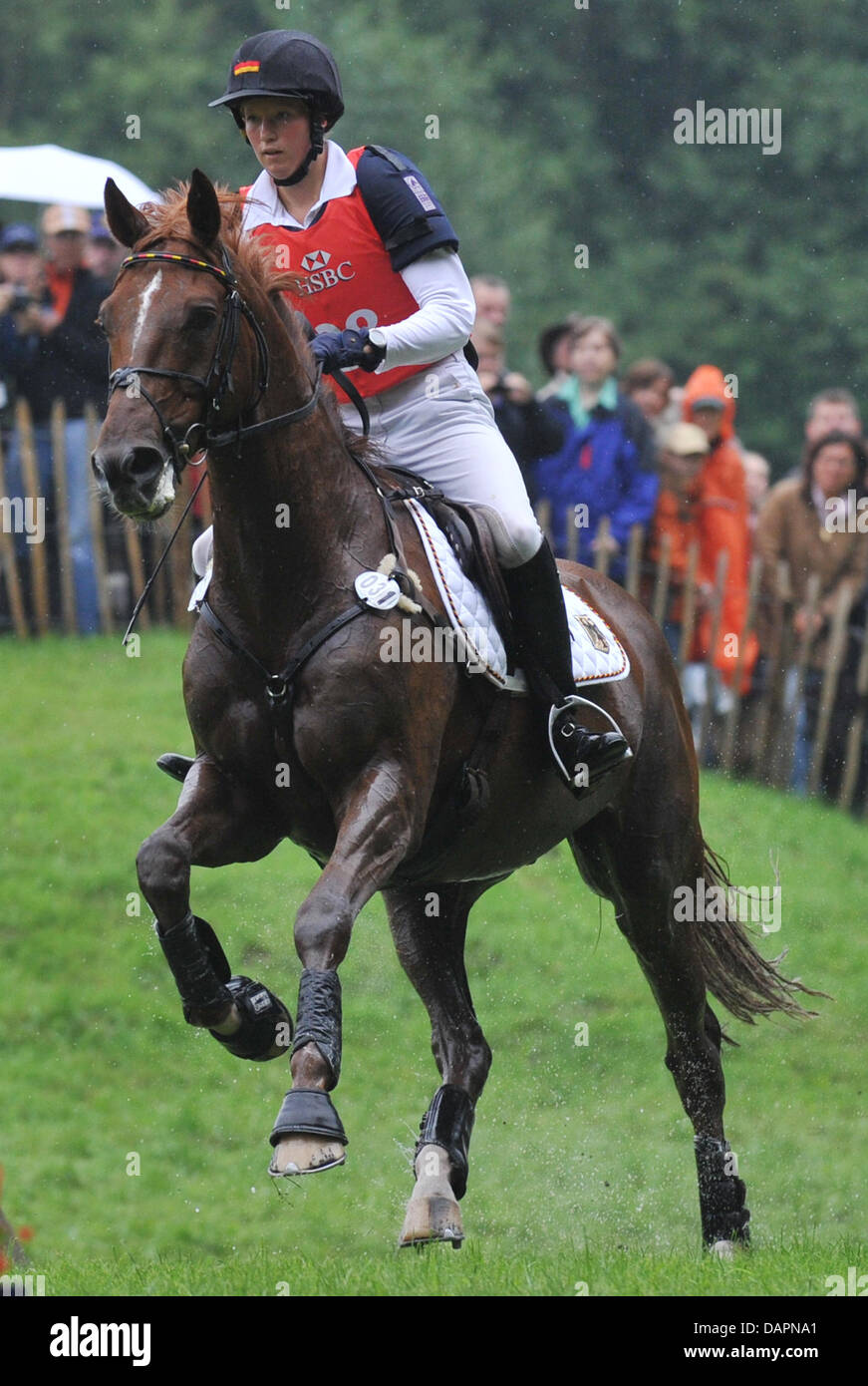 German eventing rider Sandra Auffarth jumps over a water obstacle on ...