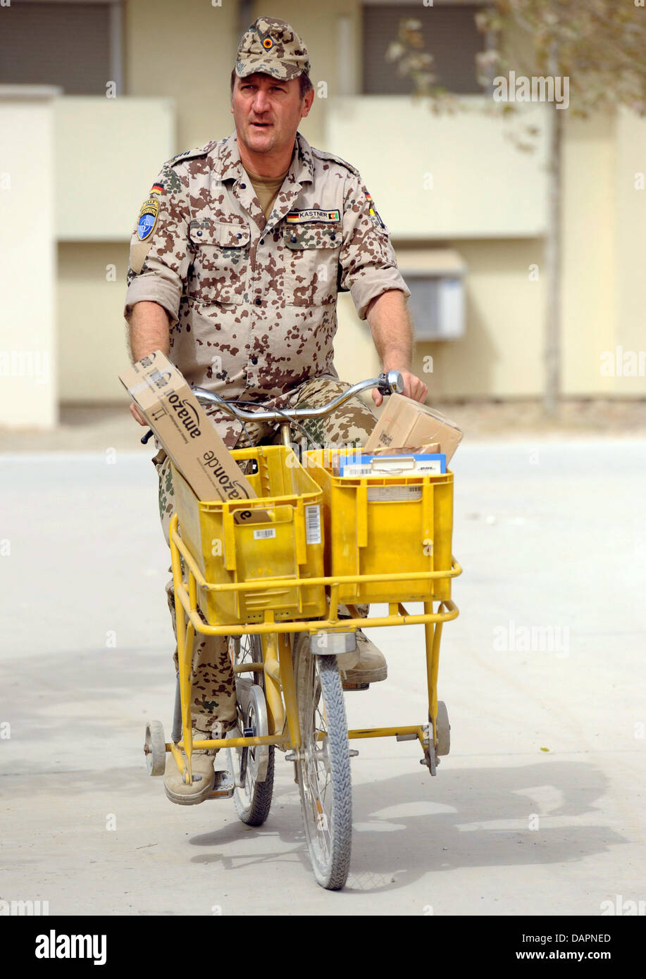 A Bundeswehr soldier from the German army postal service delivers ...