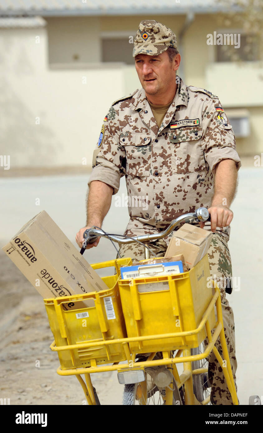A Bundeswehr soldier from the German army postal service delivers ...