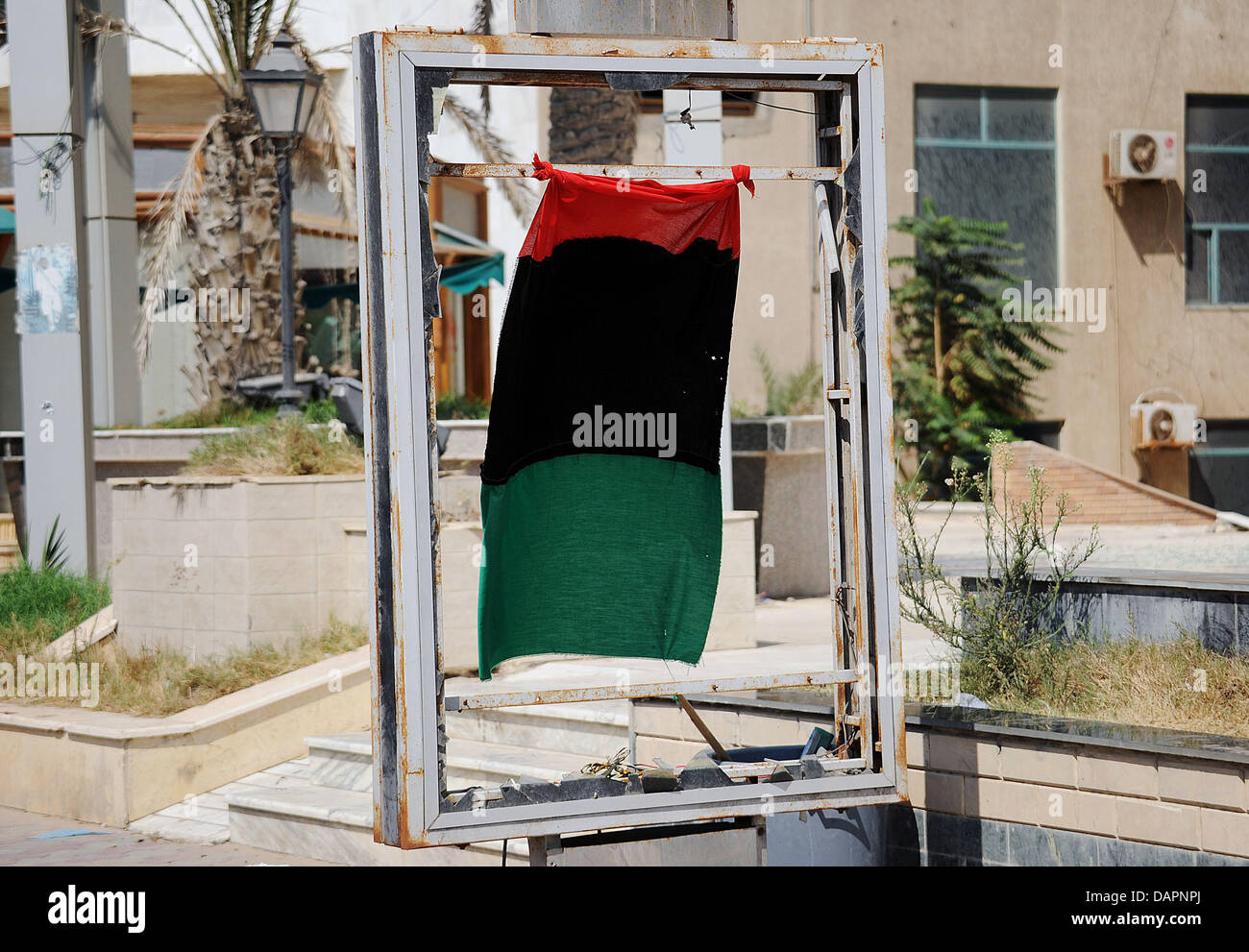 A Libyan rebels flag hangs at a checkpoint on Sunday, 28 August 2011 in ...