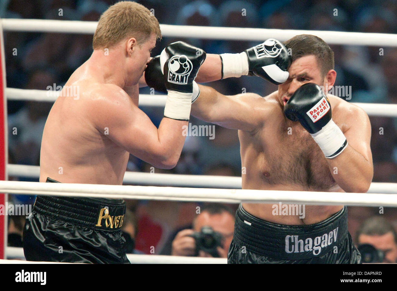 Boxing professionals Ruslan Chagaev from Uzbekistan (R) and Aleksandr ...